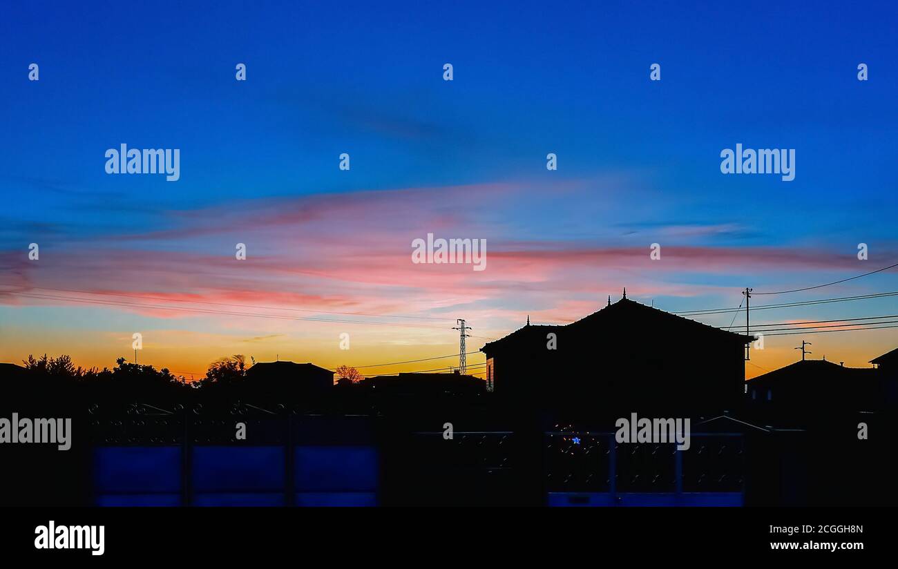Beautiful sky at sunset over residential areas Stock Photo - Alamy