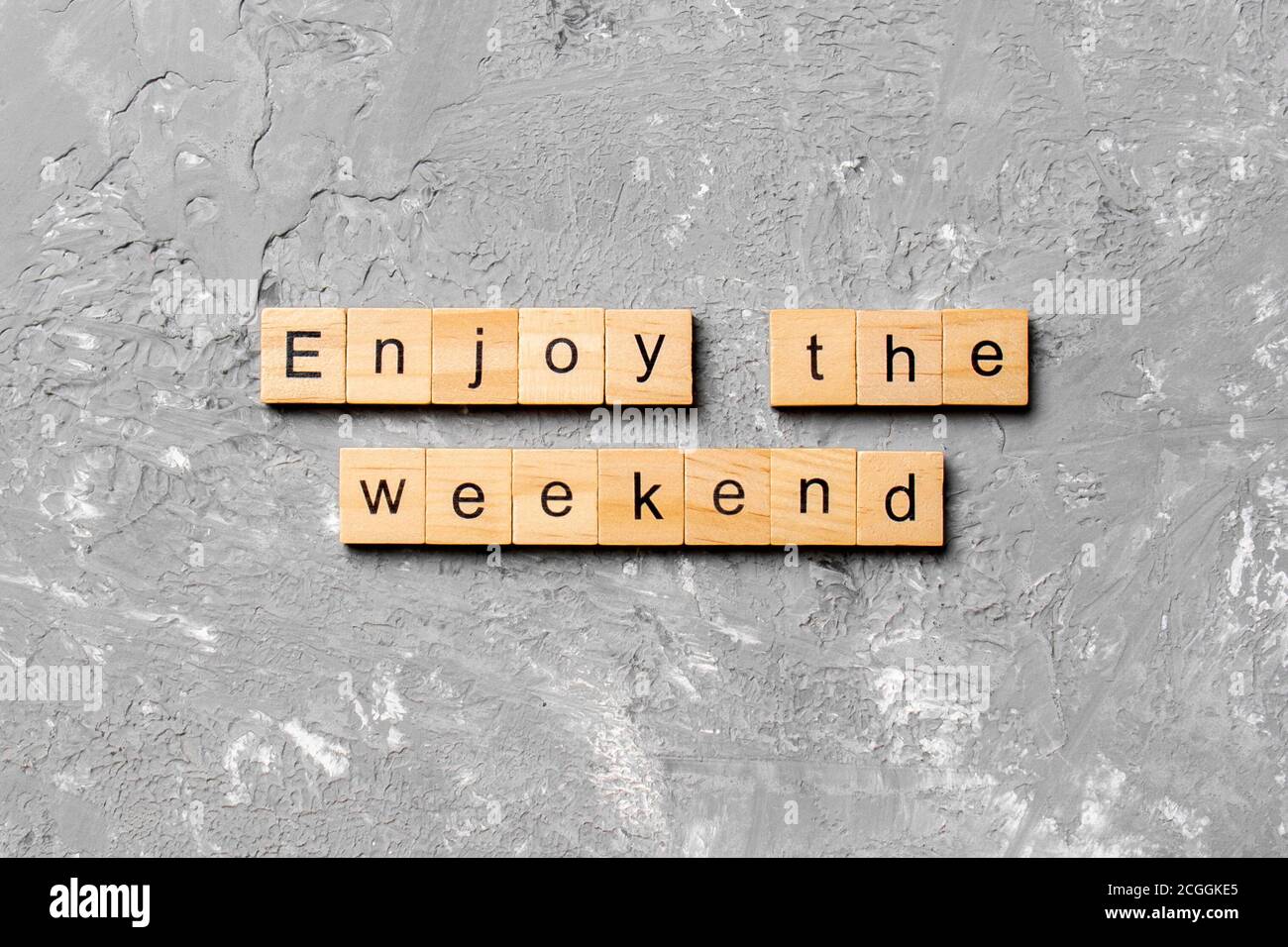 Enjoy the weekend word written on wood block. Enjoy the weekend text on ...