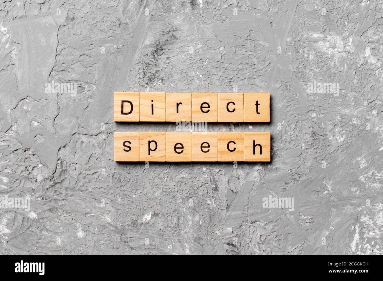 direct speech word written on wood block. direct speech text on cement ...