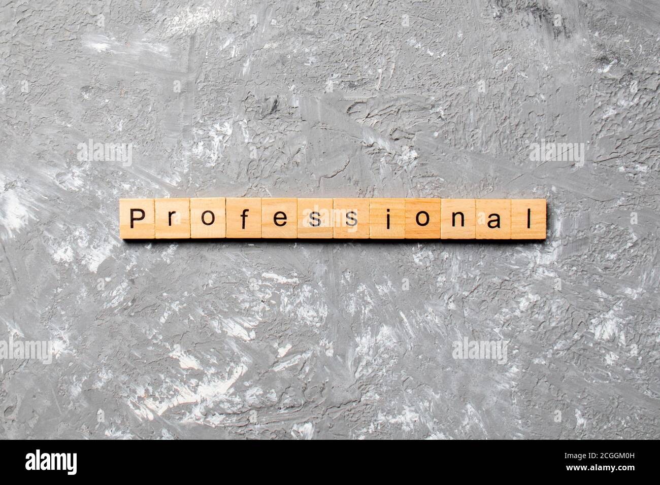 Professional word written on wood block. Professional text on cement ...