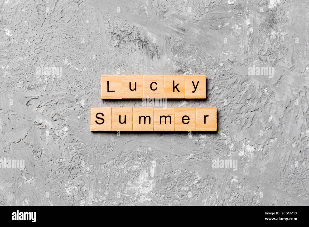 lucky Summer word written on wood block. lucky Summer text on cement ...