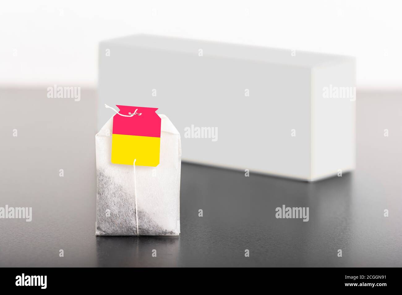 A single tea bag in front of blurred pack, editable mock-up series ...