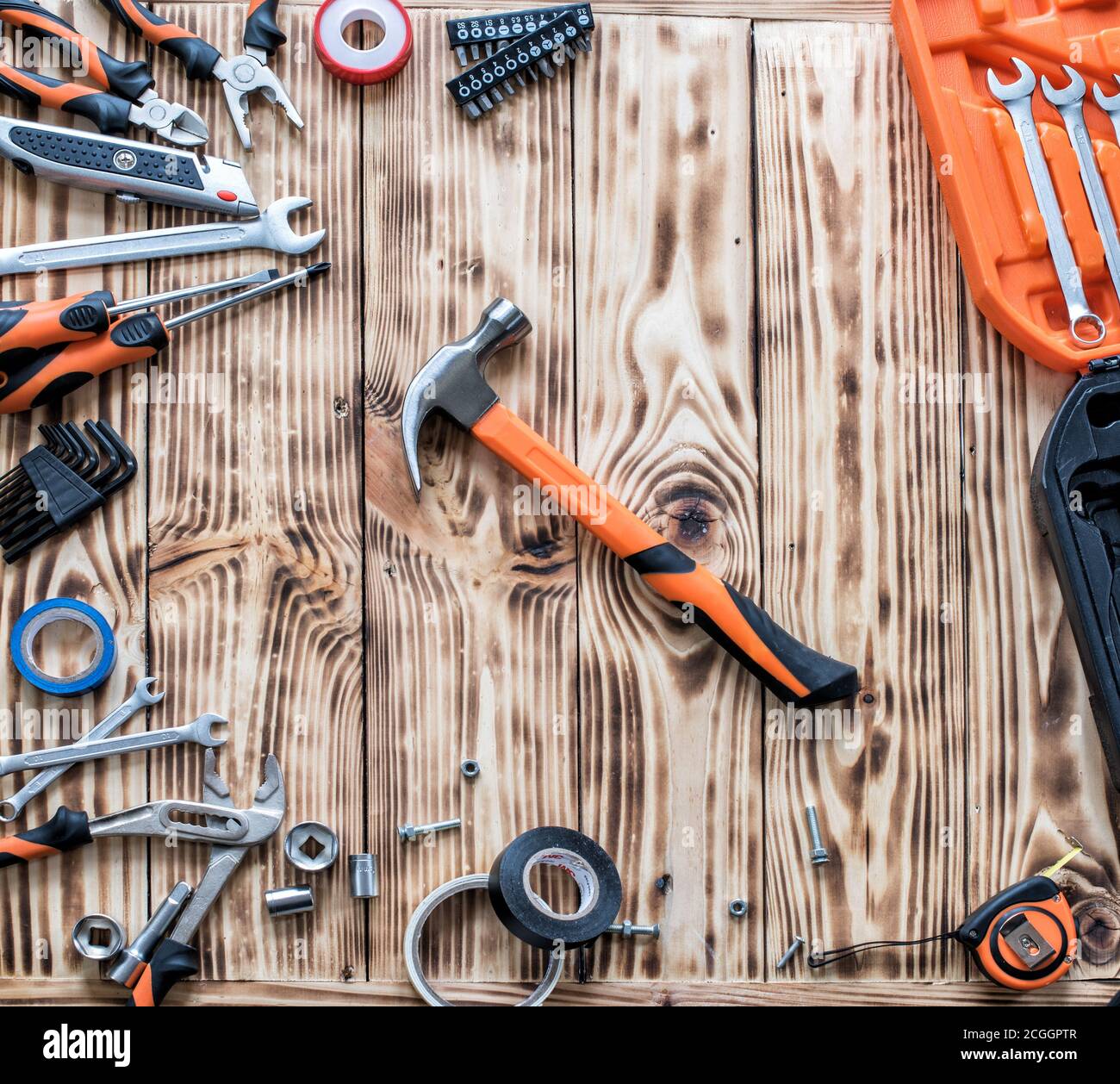 Set of tools on a wooden table background. Multifunctional tools kit ...
