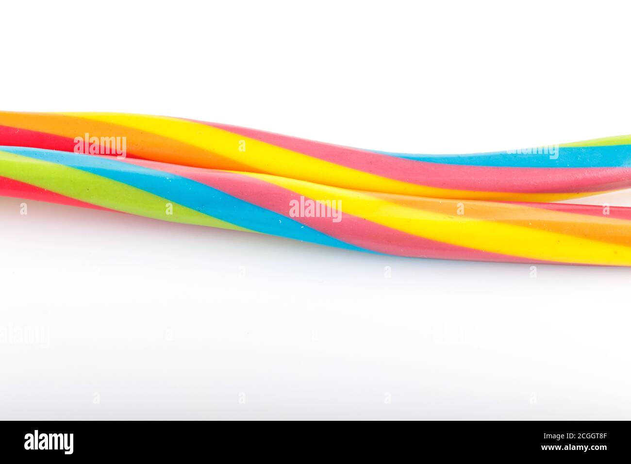 long rainbow chewing caramel sugar candies isolated on white background ...