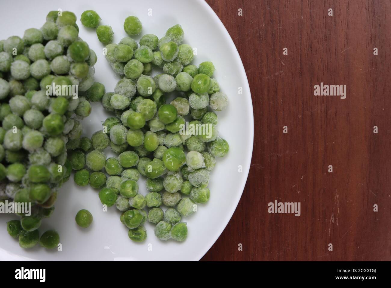 Frozen green peas, processed foods Stock Photo - Alamy