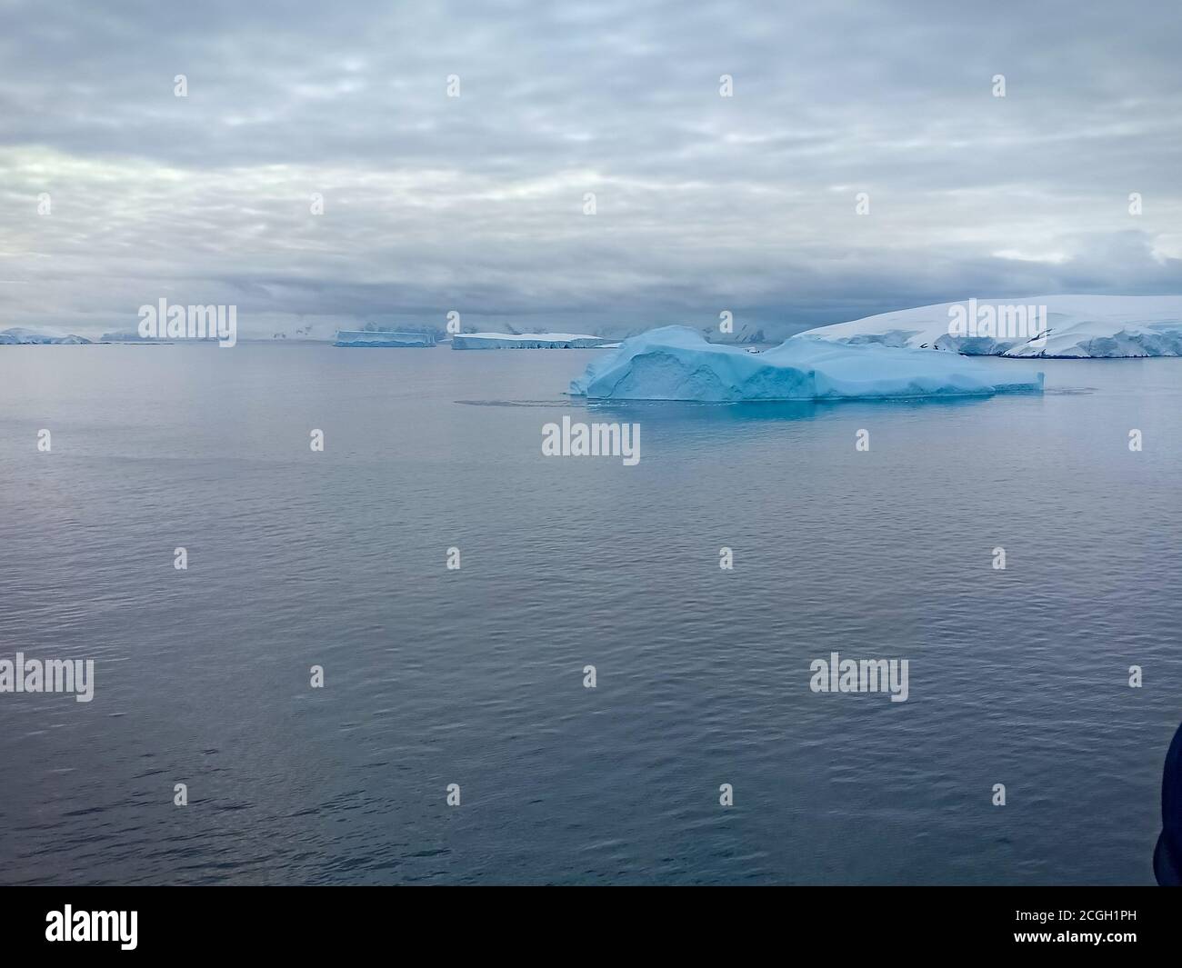 floating iceberg in Antarctica and blue ocean Stock Photo - Alamy