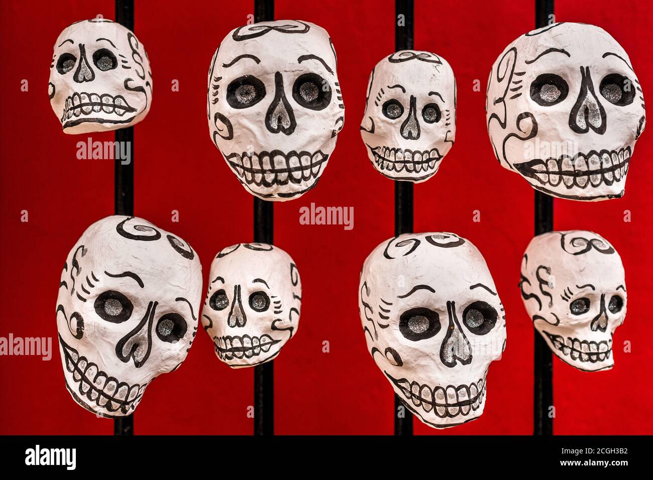 Hand-painted skulls (Calaveras) are seen placed on a street door during ...