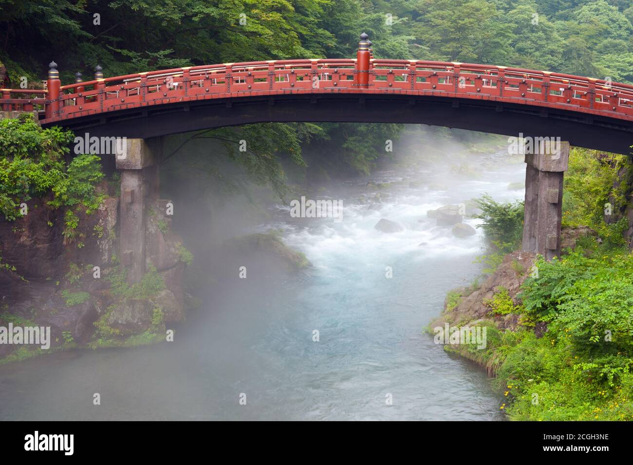 Red sacred bridge Shinkyo in Nikko, Japan and a mist rising from the river Stock Photo - Alamy