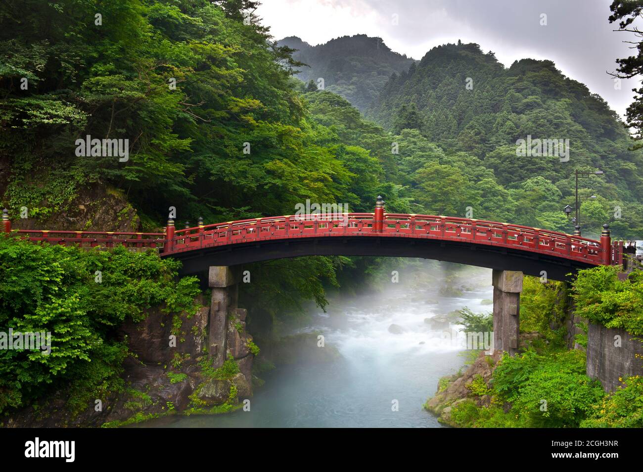 Red sacred bridge Shinkyo in Nikko, Japan and a mist rising from the river Stock Photo - Alamy
