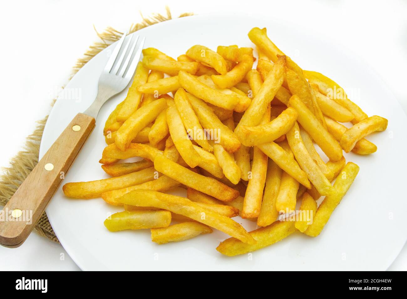 plate of french fries on a white background Stock Photo - Alamy