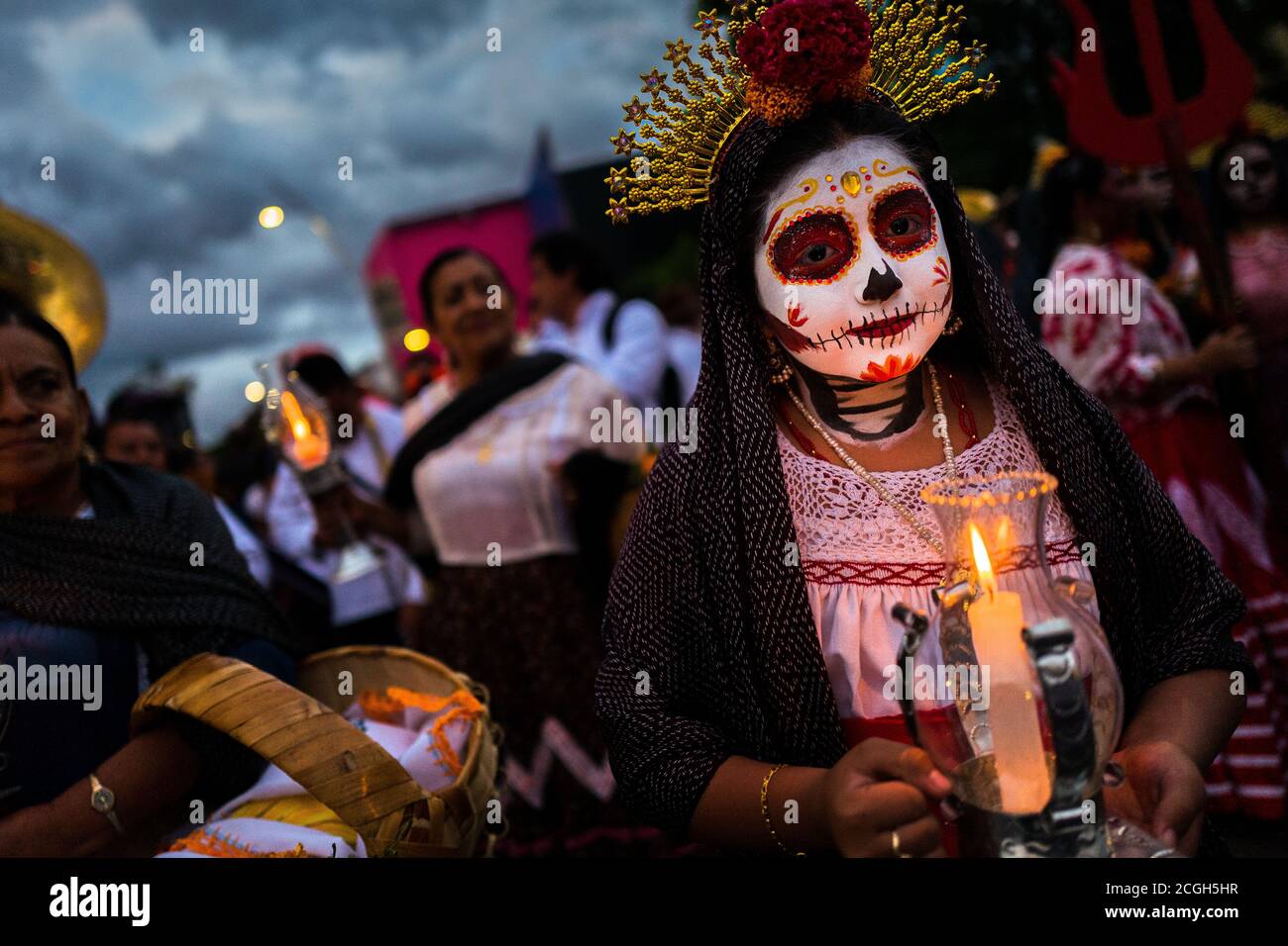A Mexican girl, dressed as La Catrina, a Mexican pop culture icon ...
