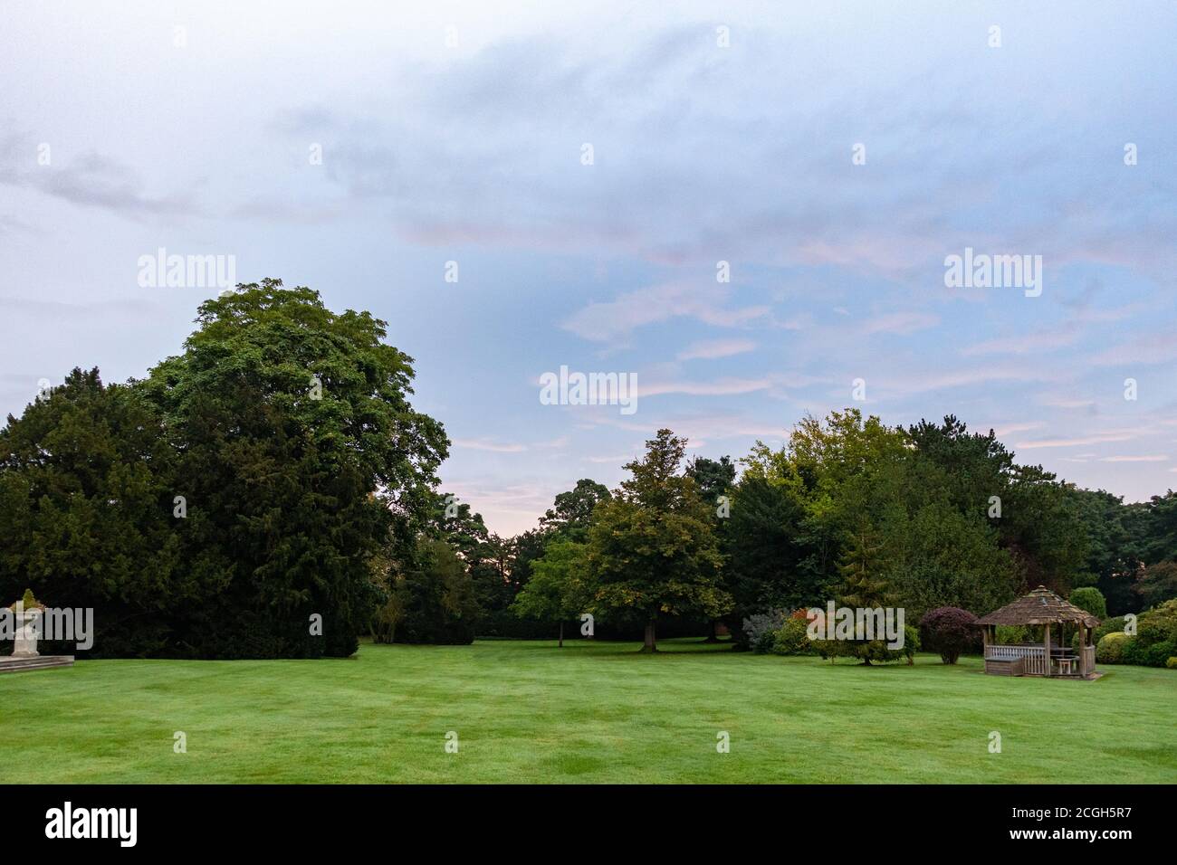 Early morning Sunrise over country house garden Stock Photo - Alamy