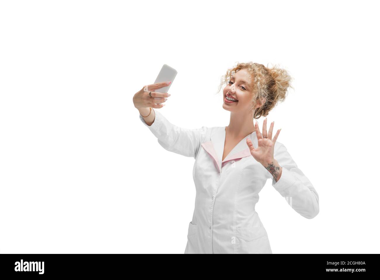 Selfie time. Portrait of female doctor, nurse or cosmetologist in white ...
