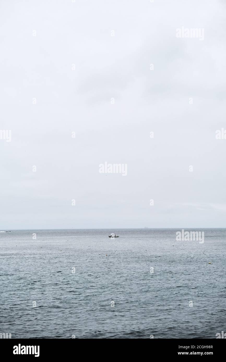 Small Isolated Lighthouse in the Distance Stock Photo - Alamy