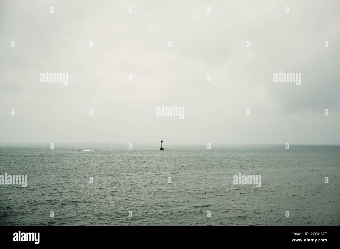 Small Isolated Lighthouse in the Distance Stock Photo - Alamy