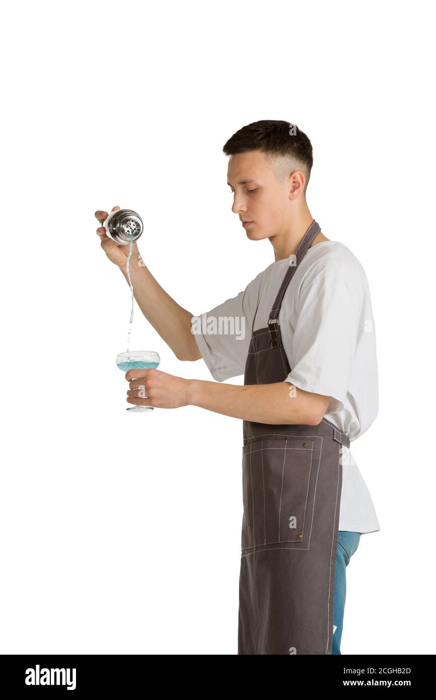 Blue lagoon. Portrait of a young male caucasian barista or bartender in ...
