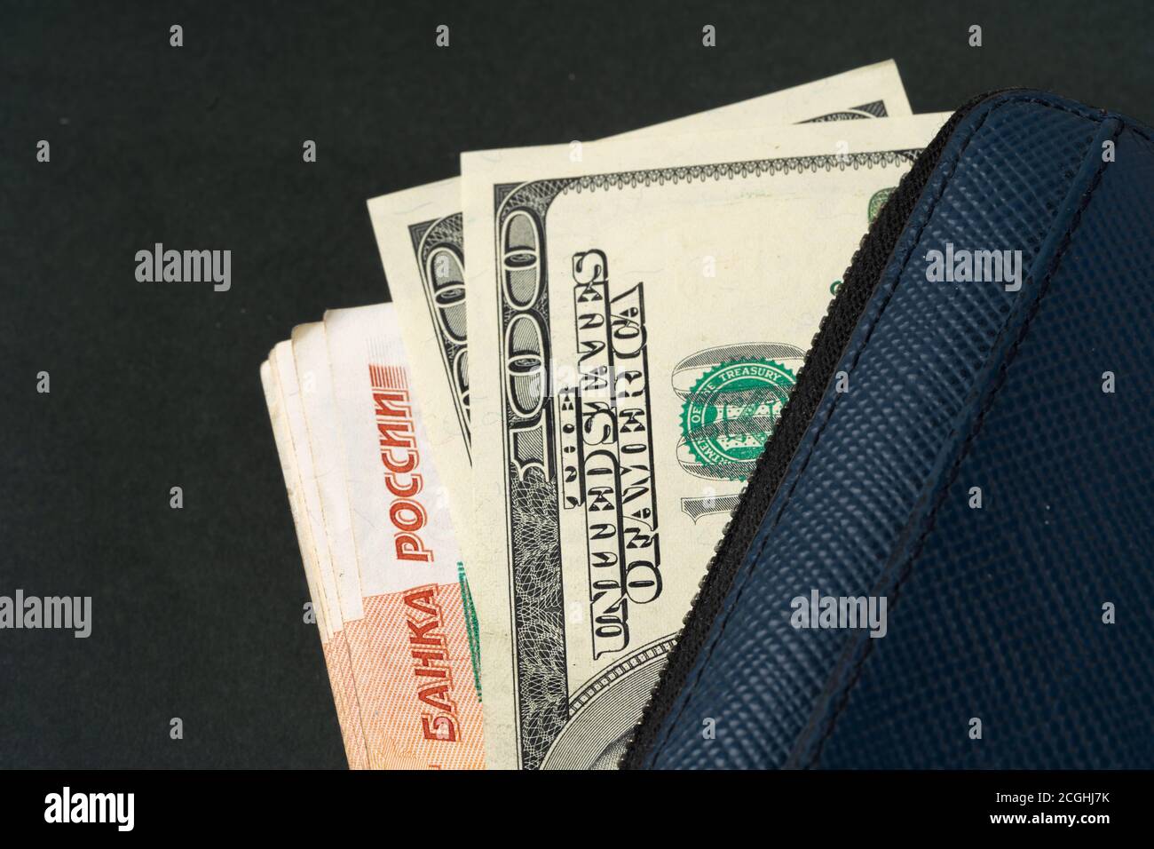Blue wallet full of money Russian Rubles and US Dollars Stock Photo - Alamy