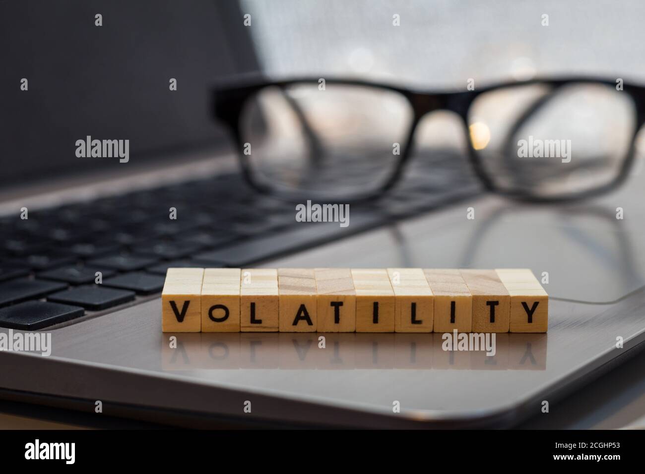 VOLATILITY letter blocks business finance concept on laptop keyboard ...