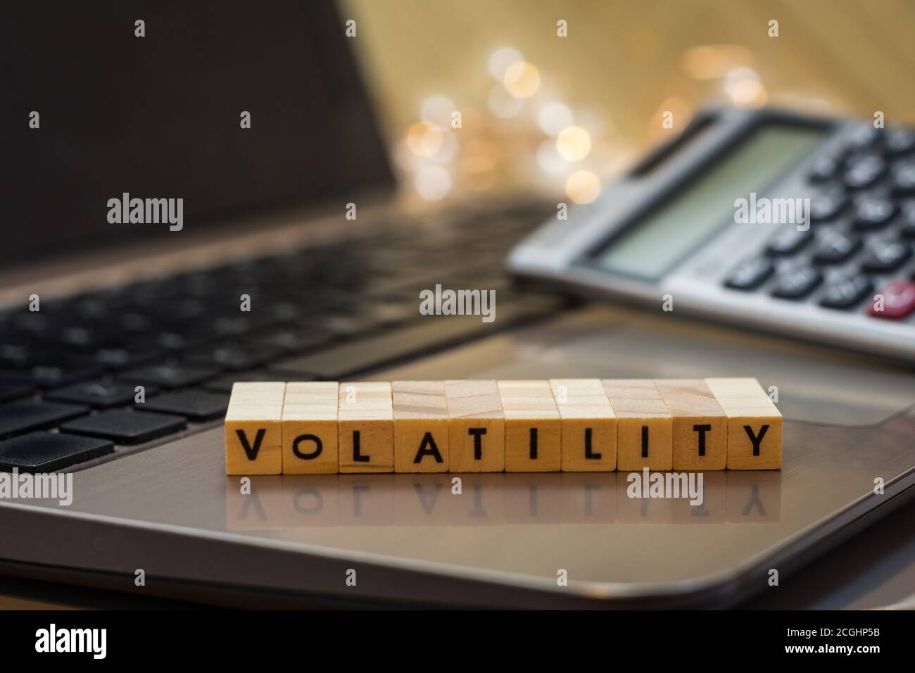 VOLATILITY letter blocks business finance concept on laptop keyboard ...