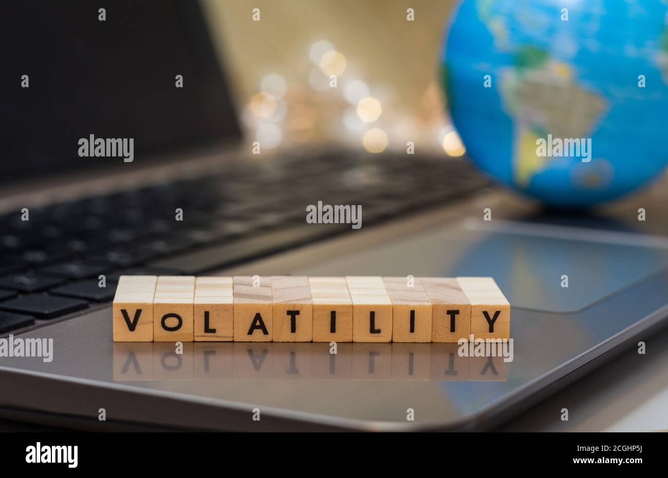 VOLATILITY letter blocks business finance concept on laptop keyboard ...