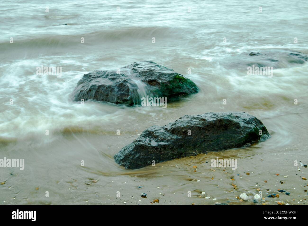 Incoming tide over the pebbles hi-res stock photography and images - Alamy