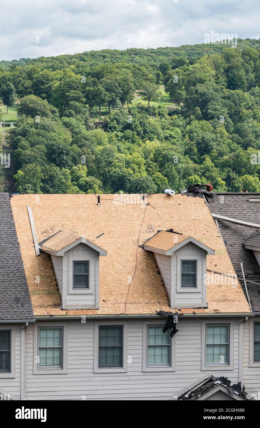 Roofing contractor has removed all the old tiles from townhouse roof ...