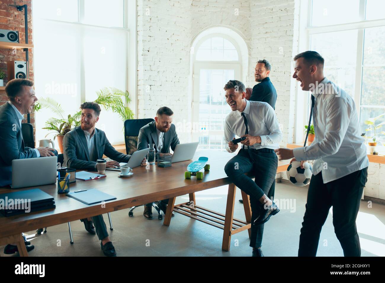 Cheerful businessman playing videogames hi-res stock photography and ...