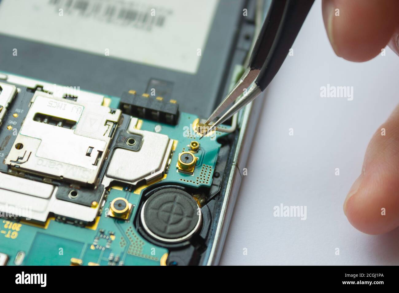 Phone repair. Electronic Board inside the phone. Close, white ...