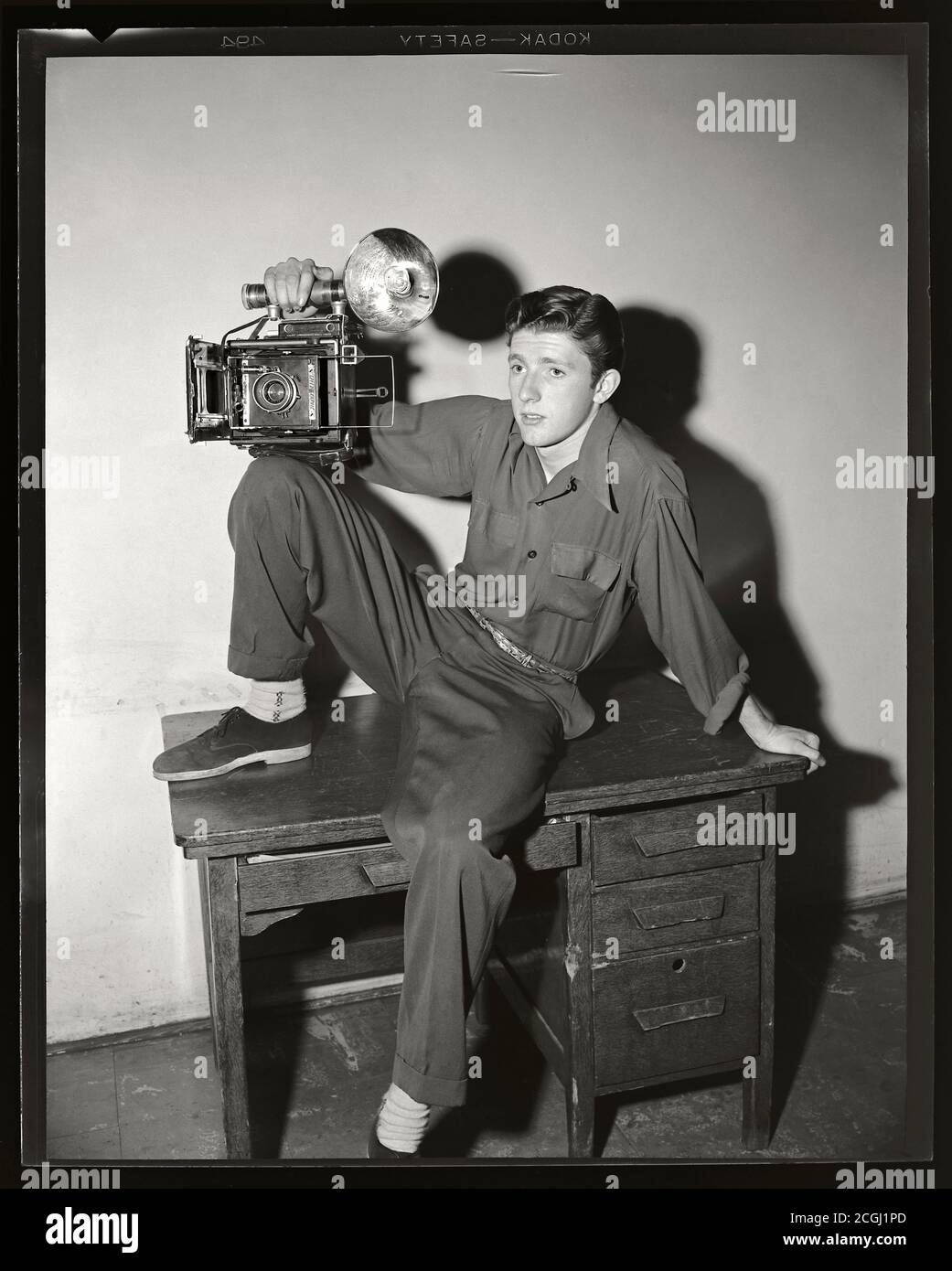 Young military photographer with Speed Graphic camera, circa 1950 ...