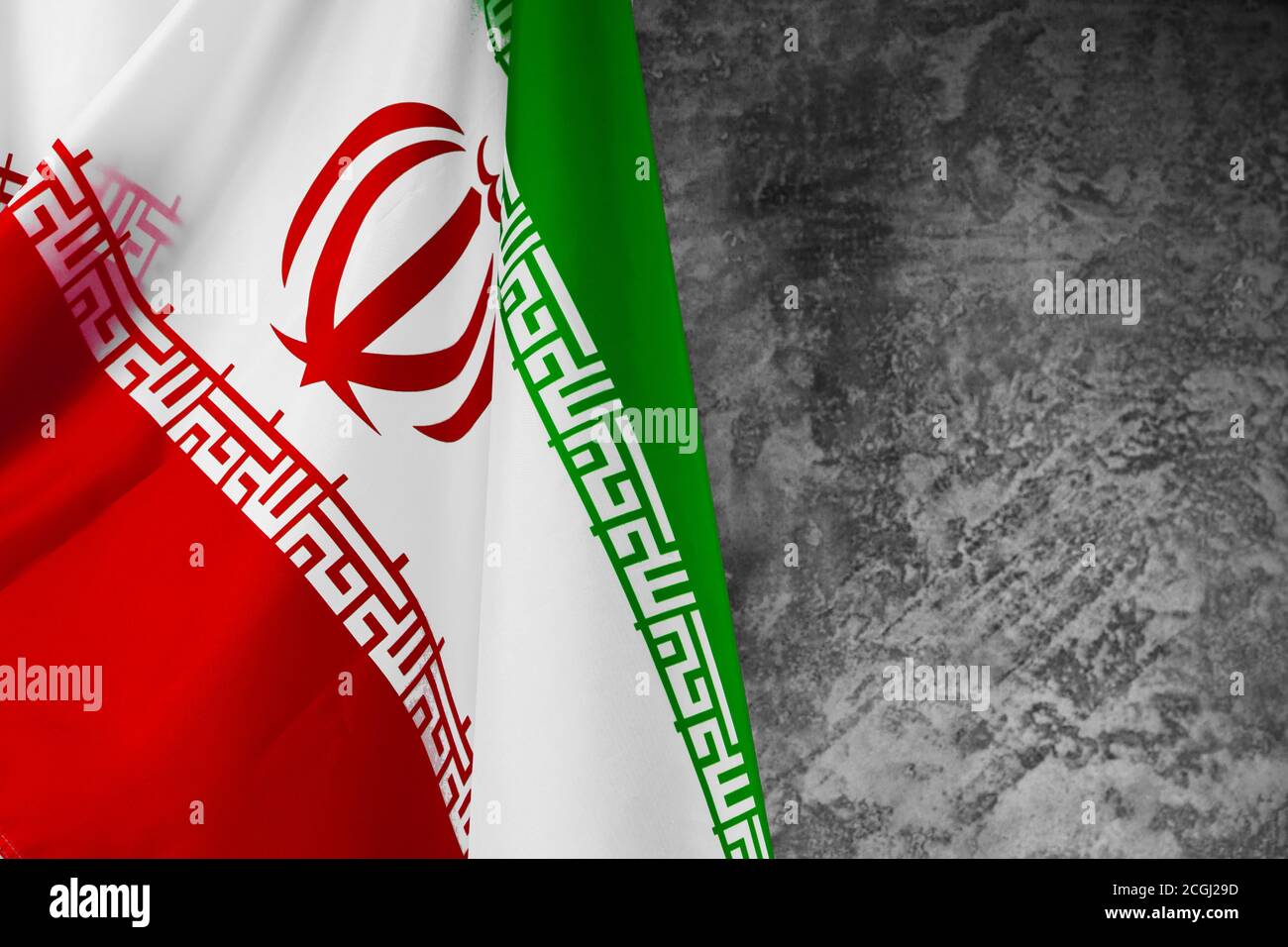 Photo of fabric flag of Iran close up Stock Photo - Alamy