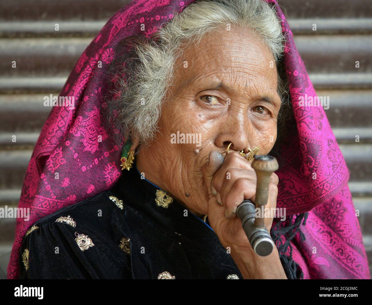 Elegant elderly Nepali Magar woman with traditional nose jewellery ...