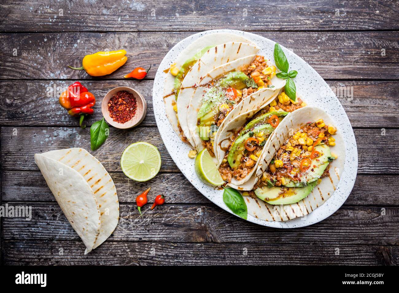 Mexican tacos with meat, beans corn and salsa. Top view Stock Photo - Alamy