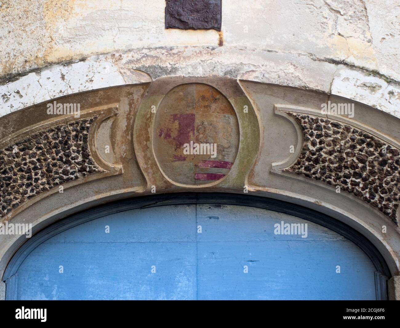 Dilapidated historical buildings, elegant entrance arch with frescoes ...