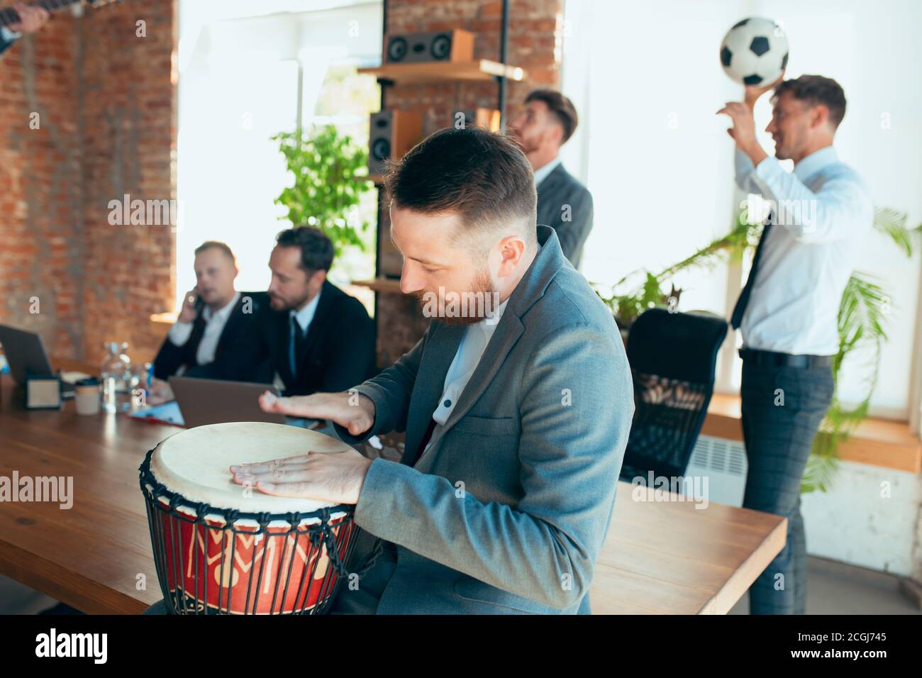 Singing, giving music concert, dancing. Happy carefree colleagues ...