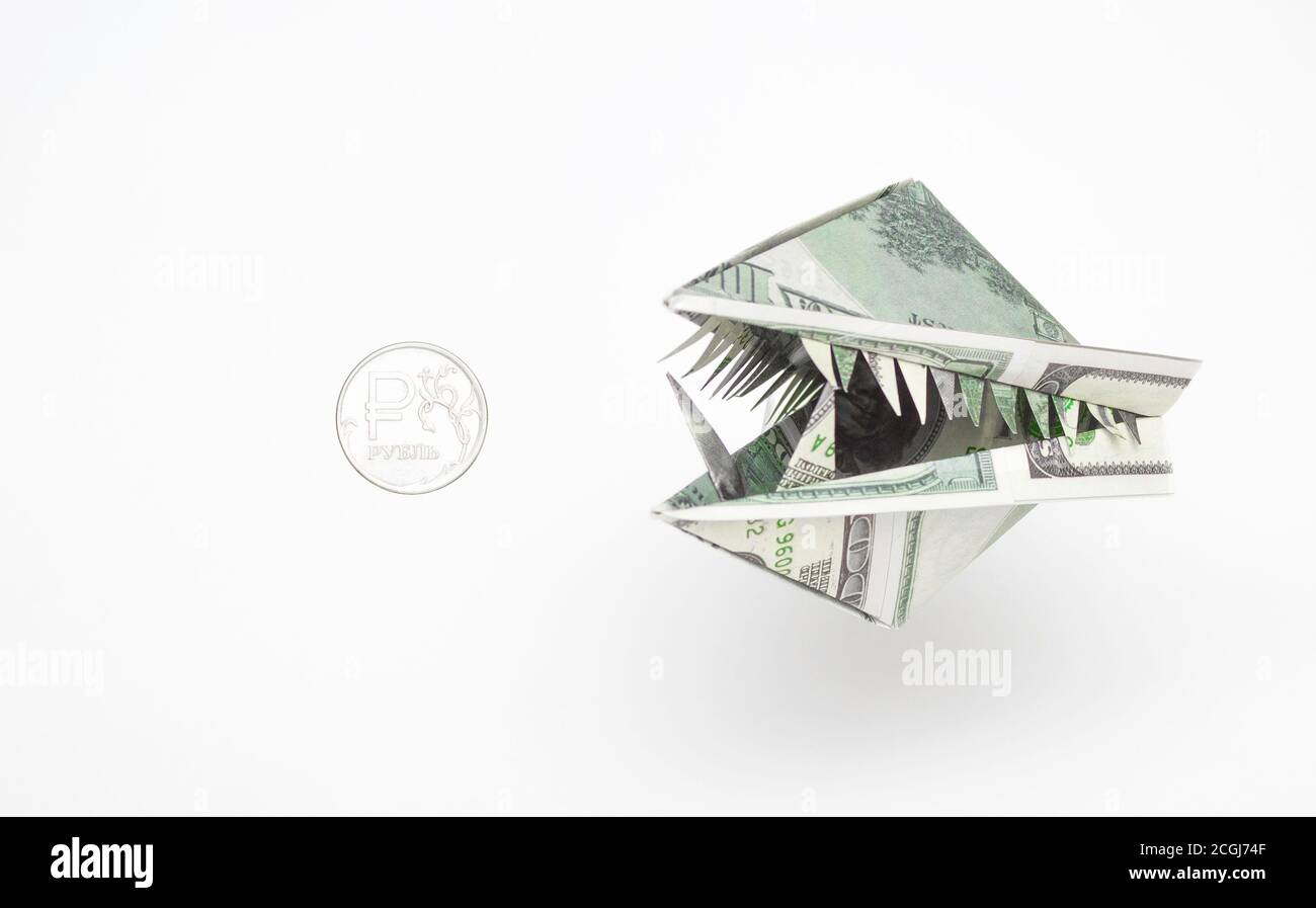 An origami figure of dollars in the form of an animal 's head with ...