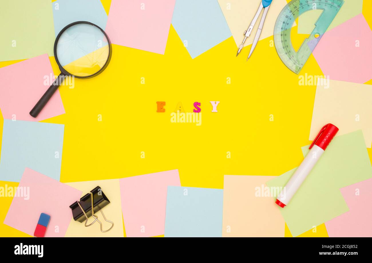 The word EASY in the center on a yellow background, colored letters ...