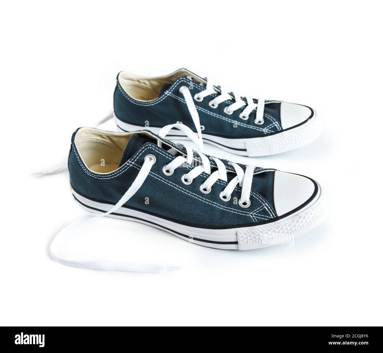 Blue generic sneakers isolated on white background Stock Photo - Alamy