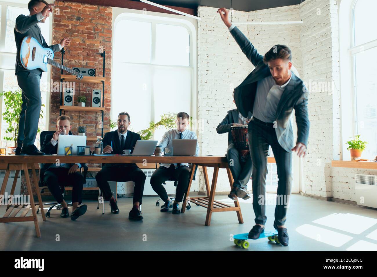 Singing, giving music concert, dancing. Happy carefree colleagues ...