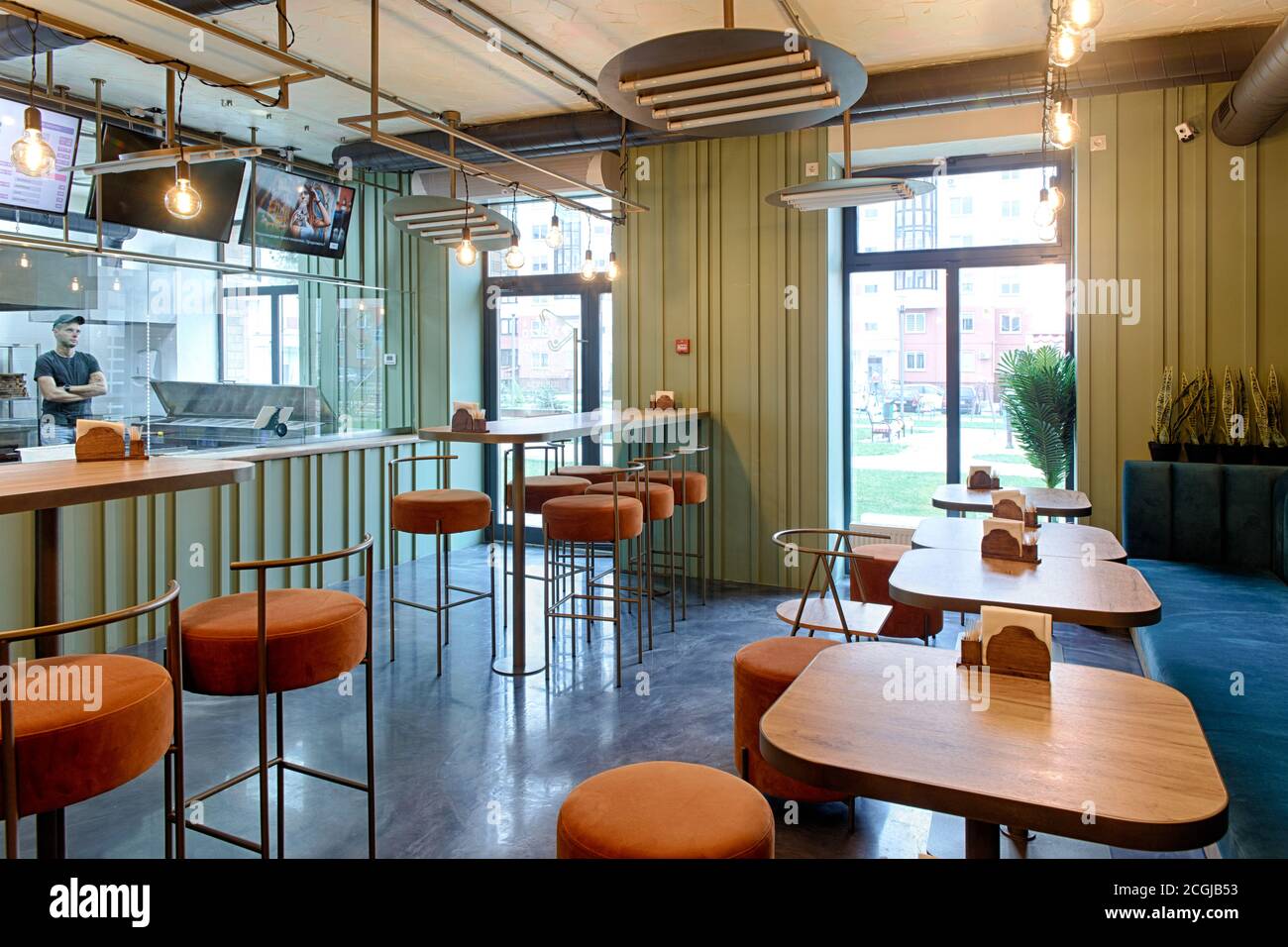 Interior of a restaurant, modern design in few colors, orange and blue ...