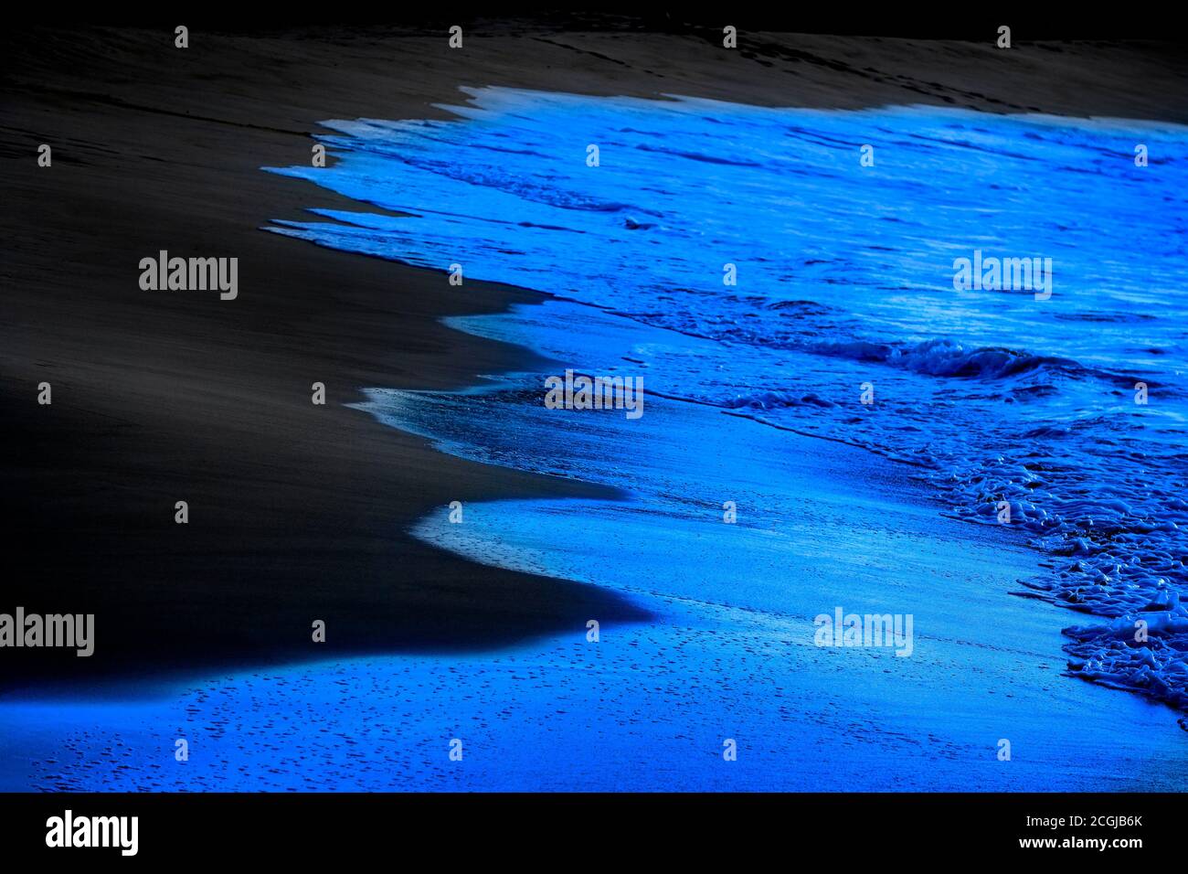 Bright blue wabes on a beach from ocean swell water clean and fresh ...