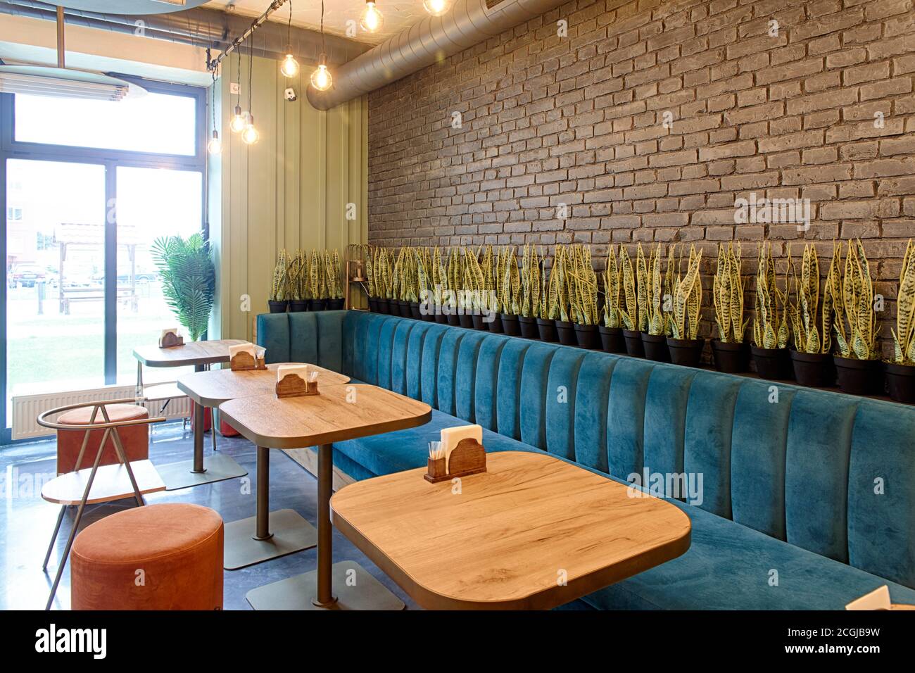Interior of a restaurant, modern design in few colors, orange and blue ...