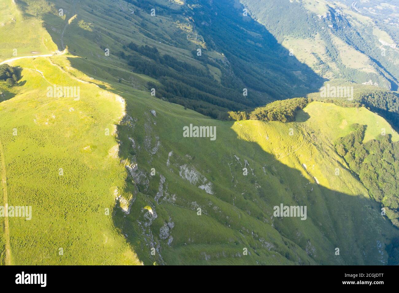 aerial view of a green grassland in the mountain area of Gran Sasso ...