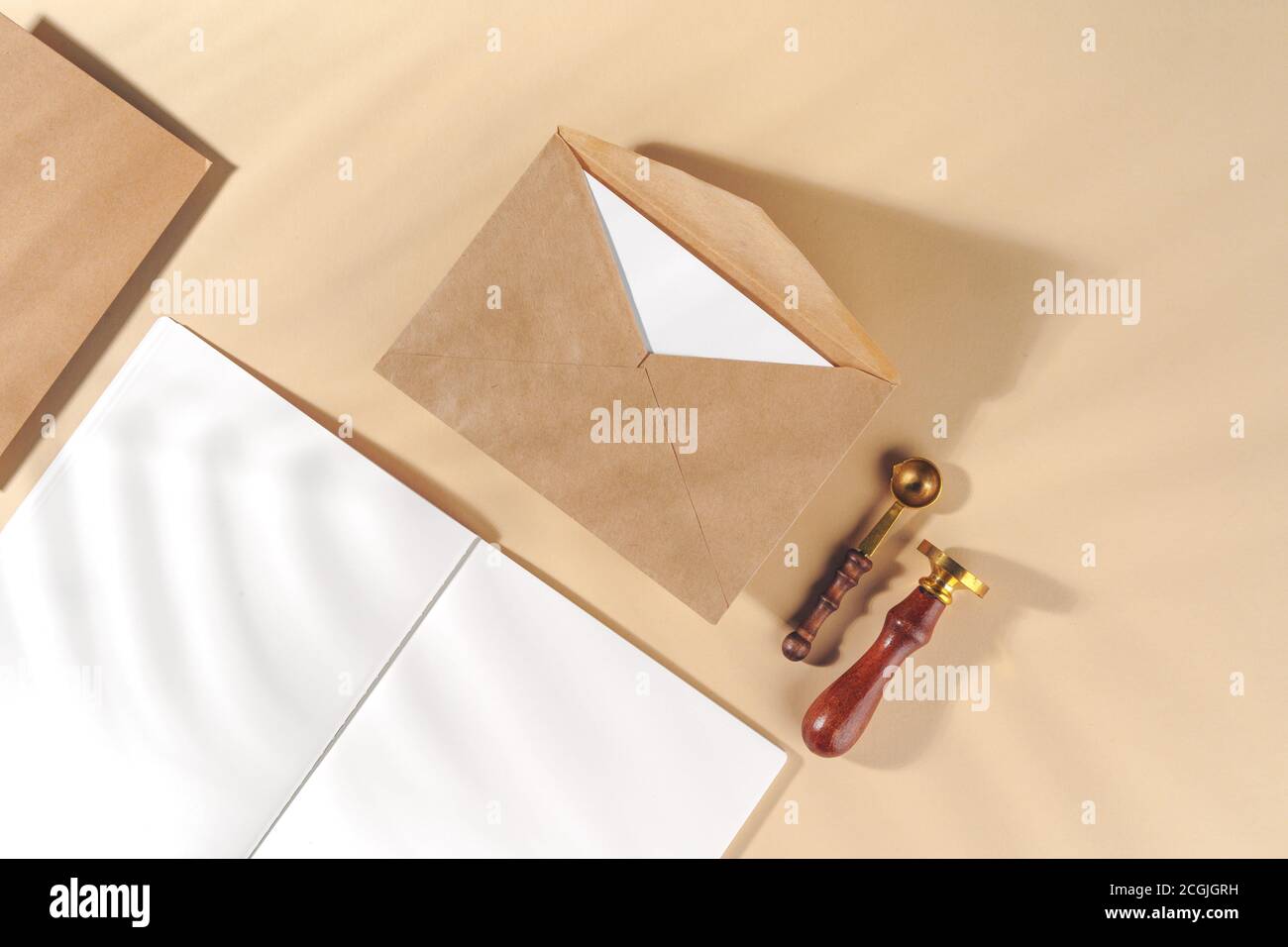 Craft paper letter on beige background top view Stock Photo - Alamy