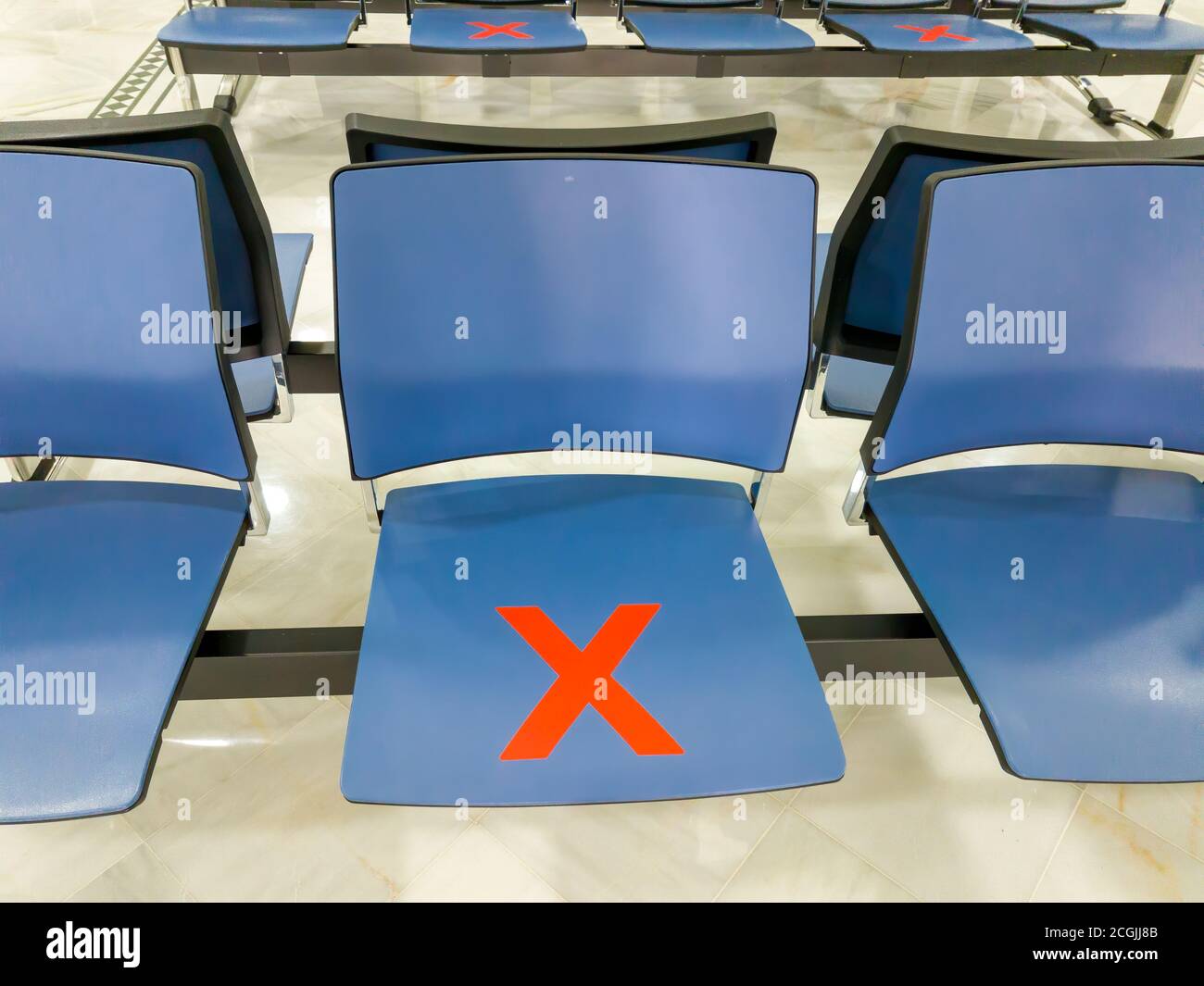 Social distance concept. Red symbol sticker placed on a chair in the ...