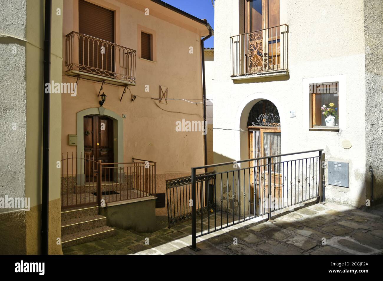 A narrow street among the old houses of Calvello, a rural village in ...