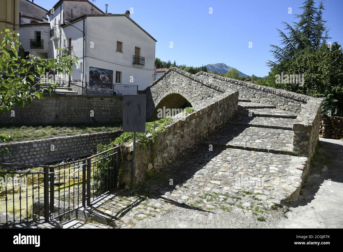 A narrow street among the old houses of Calvello, a rural village in ...