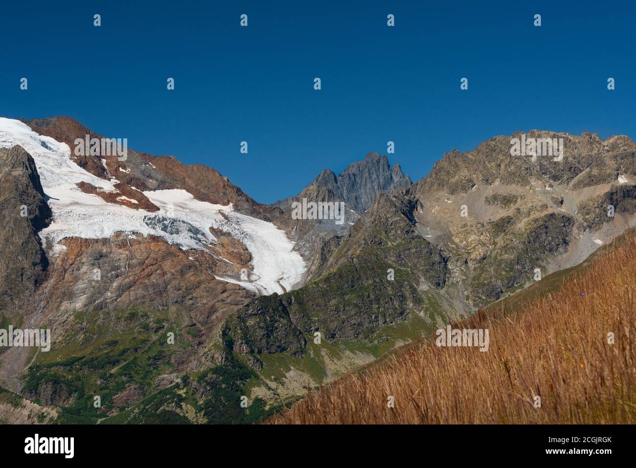 mountain peaks of three colors of red, blue and yellow in Dombai Stock ...