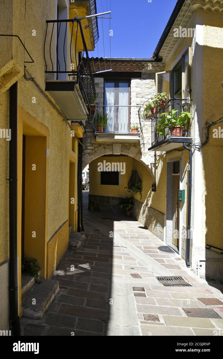 A narrow street among the old houses of Calvello, a rural village in ...