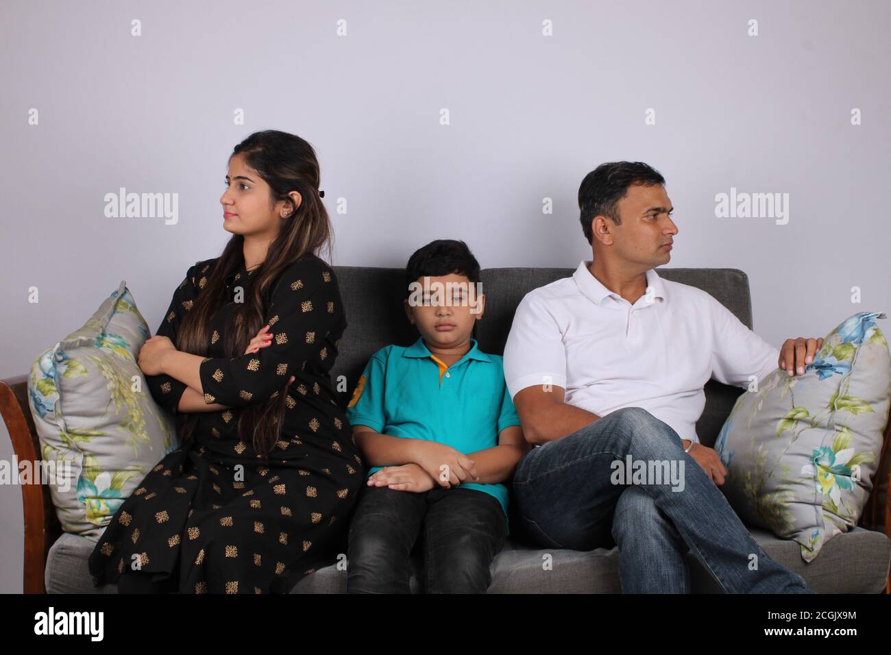 mother, father and son ignoring each other after argument. children and ...