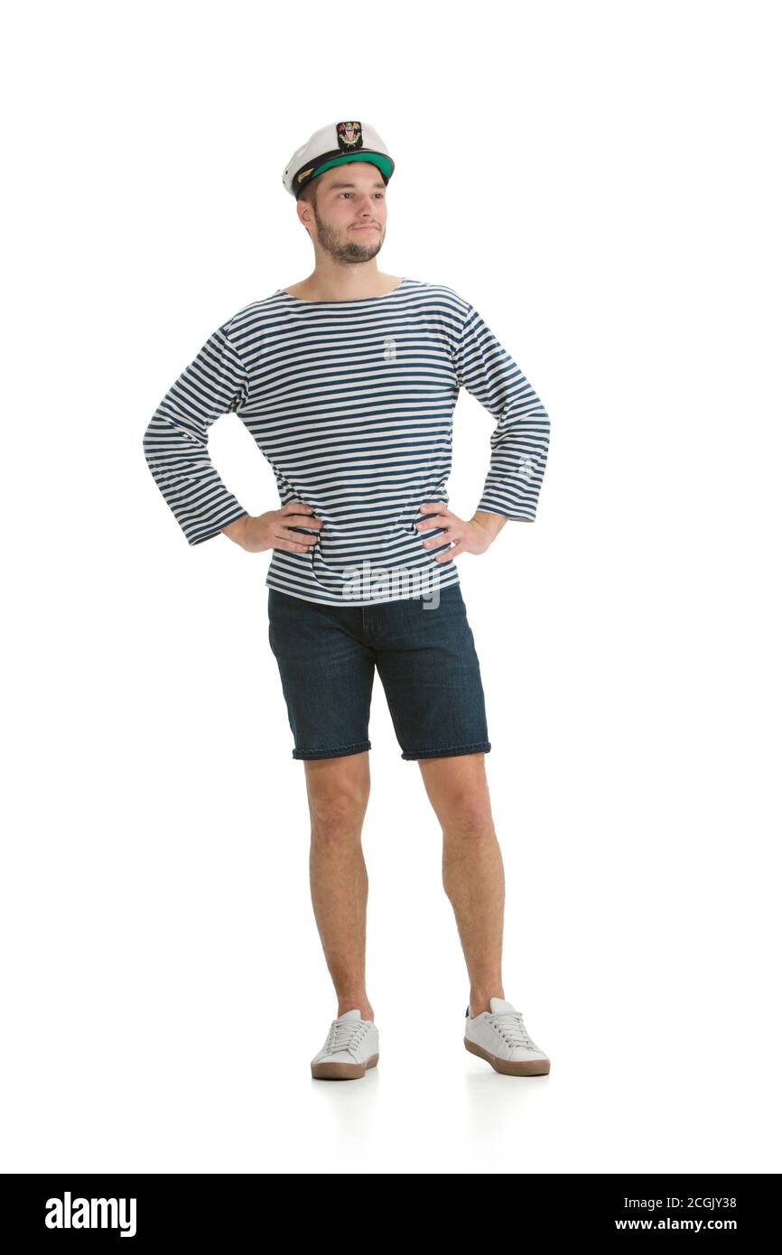 Posing confident. Caucasian male sailor in uniform on white studio ...